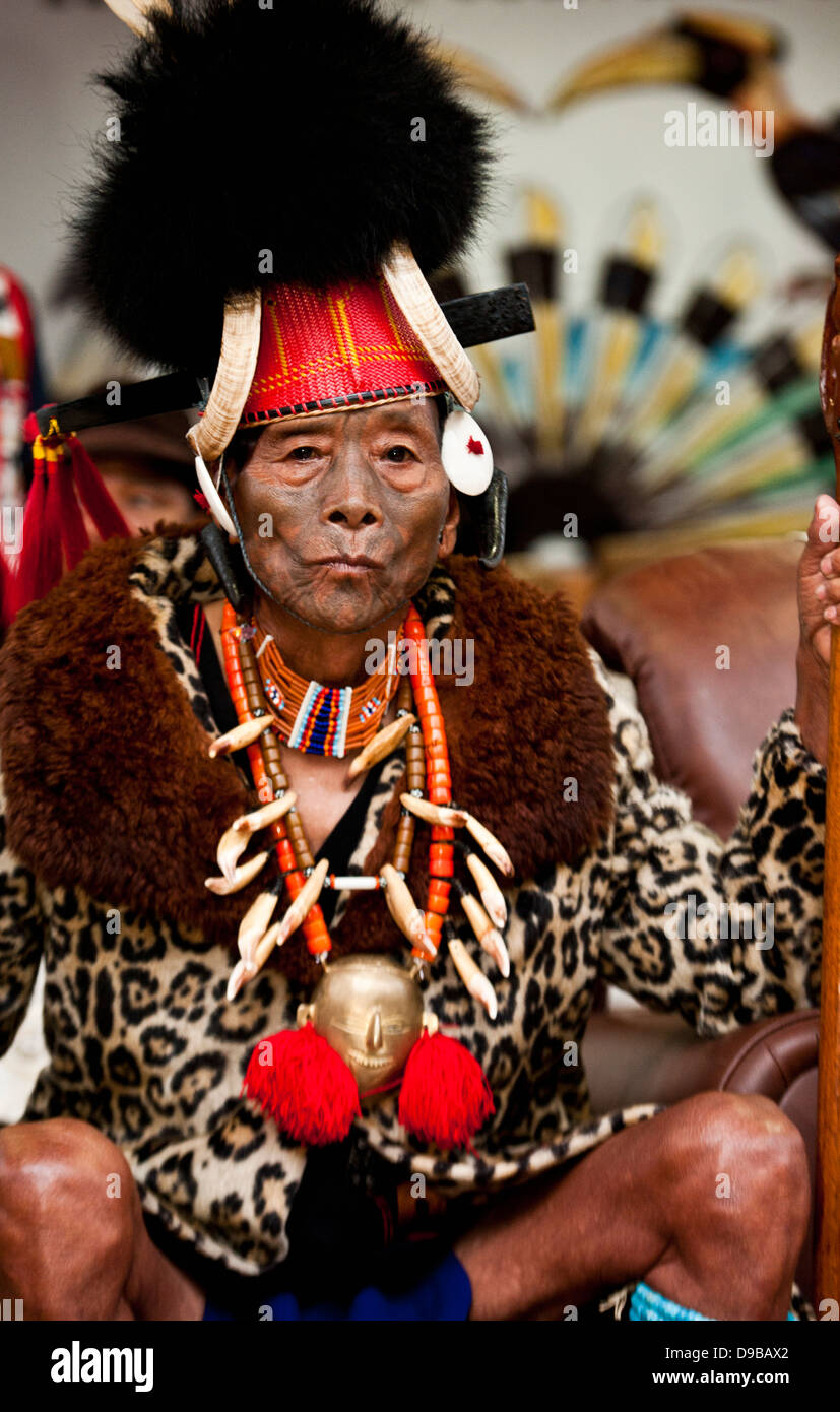Elderly Naga tribesman in traditional outfit during the annual Hornbill ...