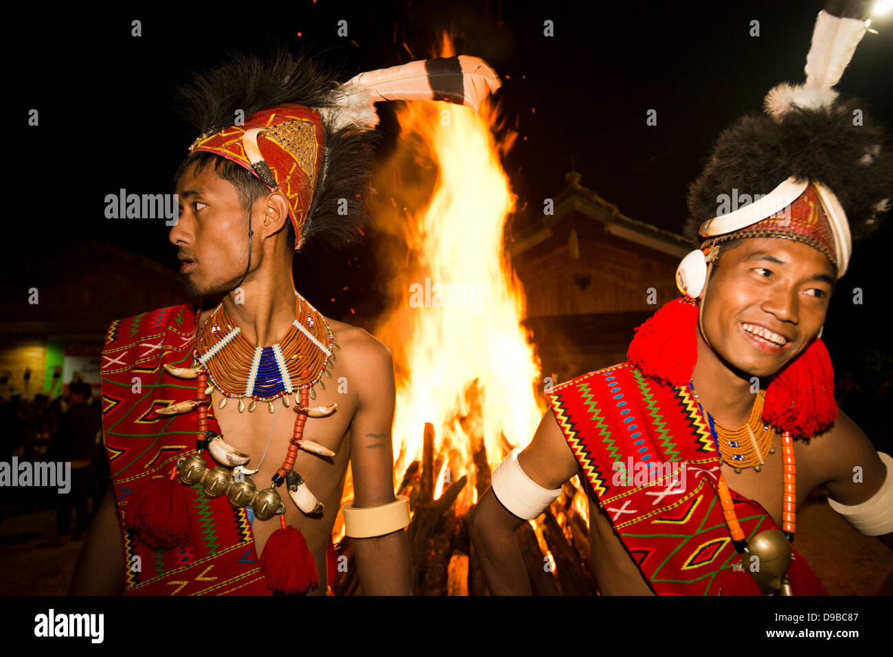 Naga tribesmen in front of fire during the annual Hornbill Festival at ...