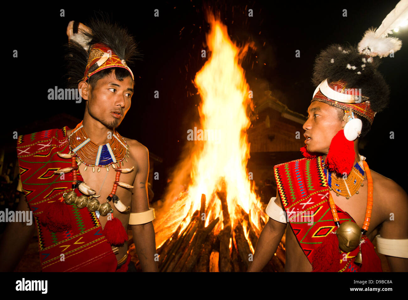 Naga tribesmen in front of fire during the annual Hornbill Festival at ...