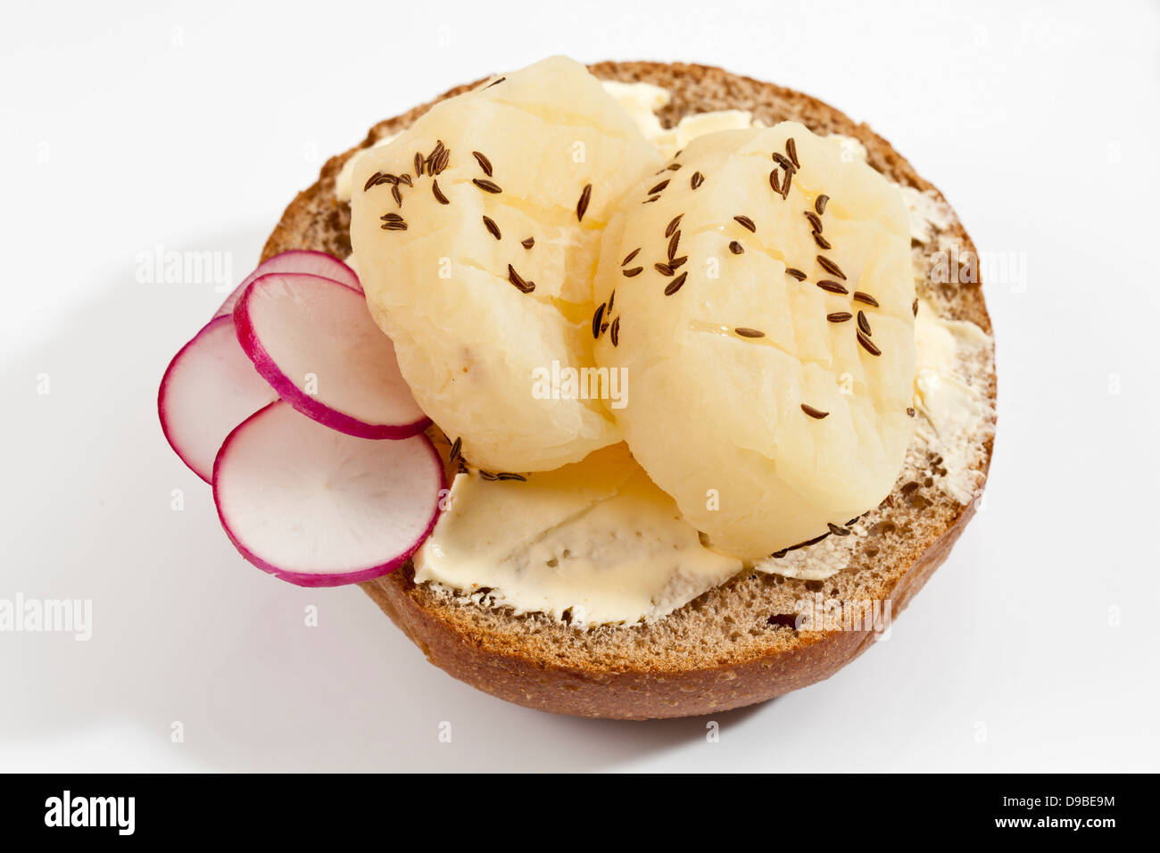 Rye roll with Harzer Roller cheese and caraway on white background ...