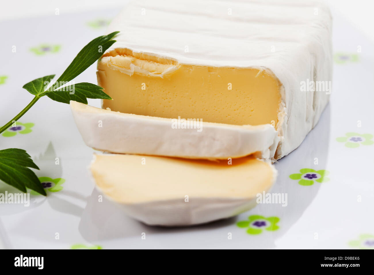 French soft cheese on chopping board, close up Stock Photo - Alamy