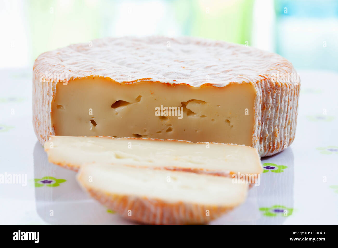 French soft cheese on chopping board, close up Stock Photo - Alamy