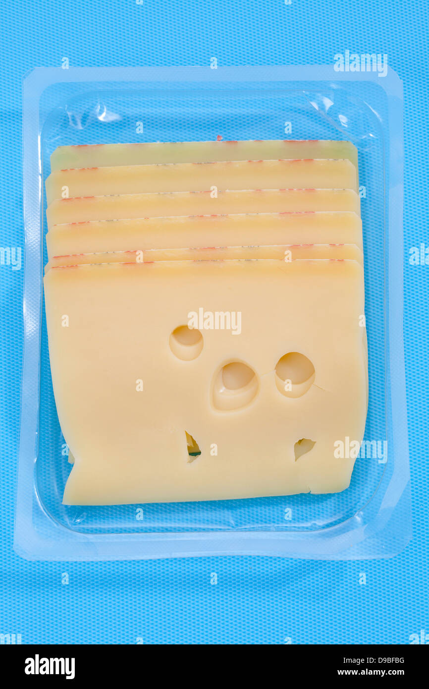 Slices of emmental cheese in plastic box hi-res stock photography and ...