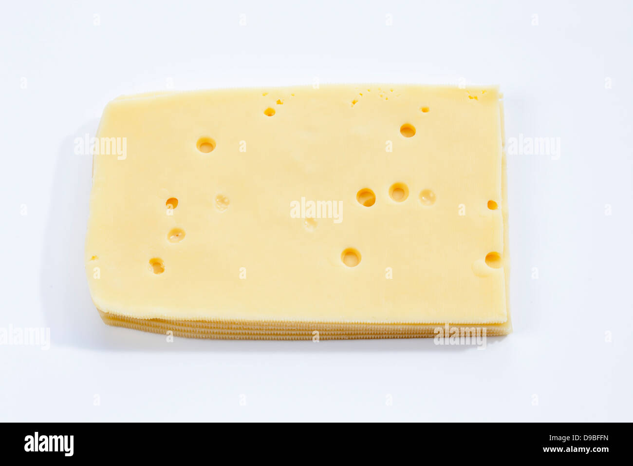 Slices of Maasdammer Cheese on white background Stock Photo - Alamy