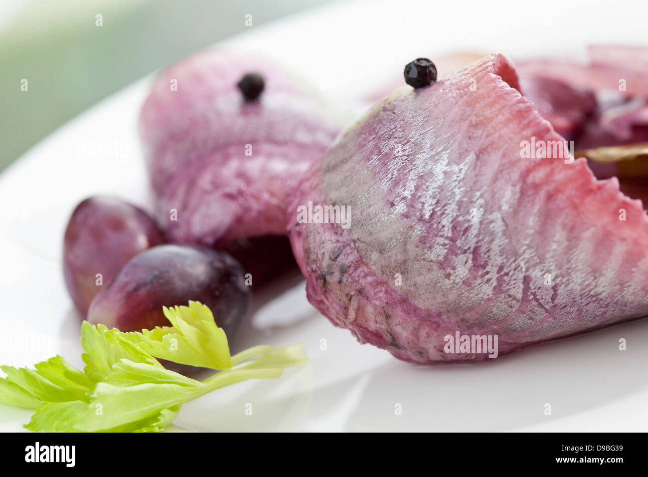 Herring with onions and vinegar on plate hi-res stock photography and ...