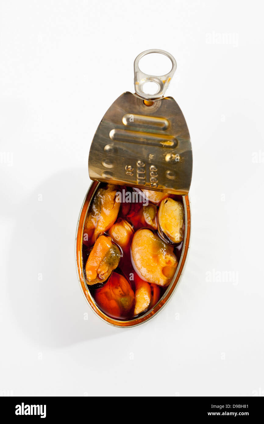 Can of mussels in oil on white background Stock Photo - Alamy