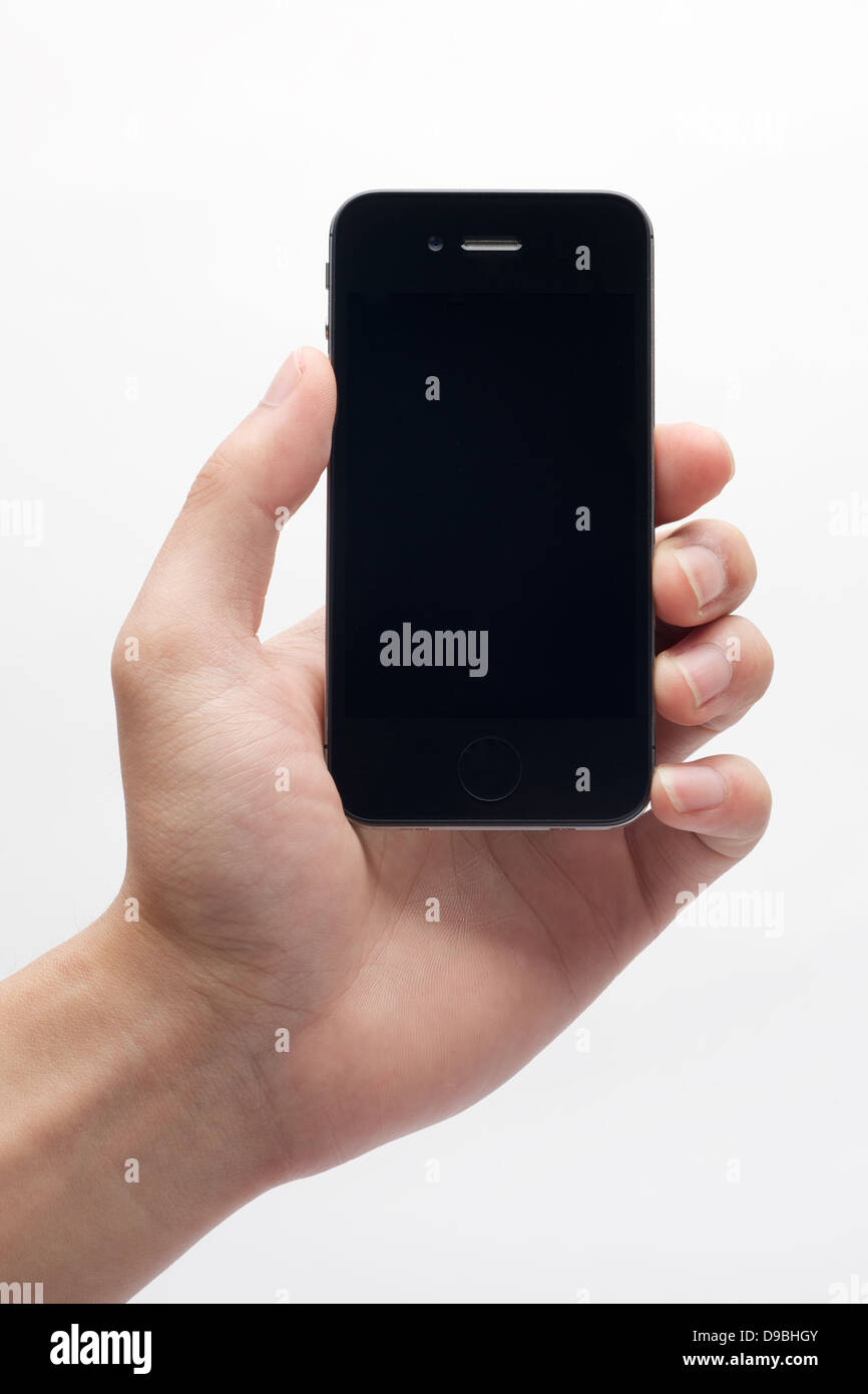 Hand holding iphone in white background Stock Photo - Alamy