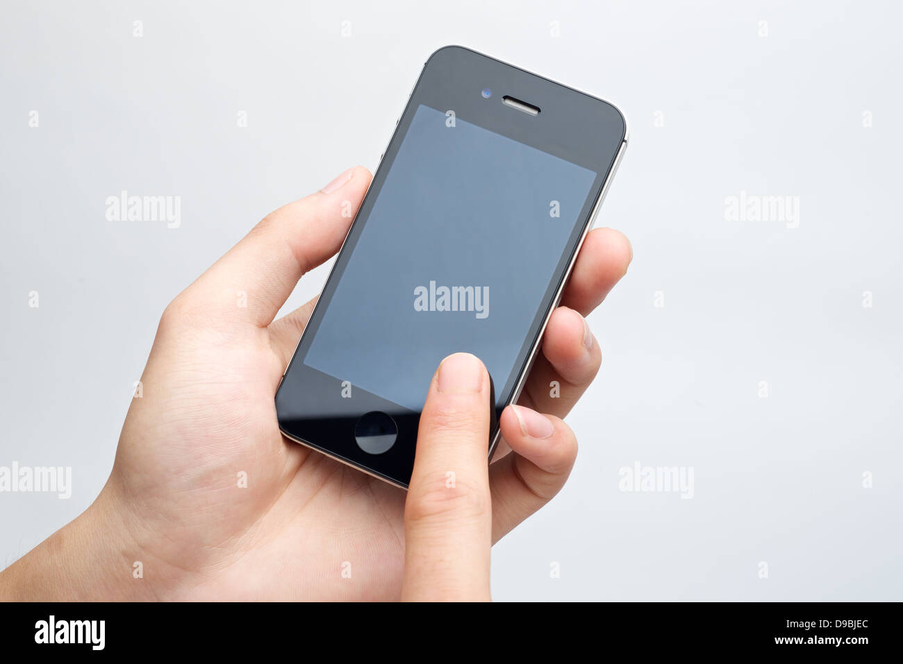 Finger touching iphone on white background Stock Photo - Alamy
