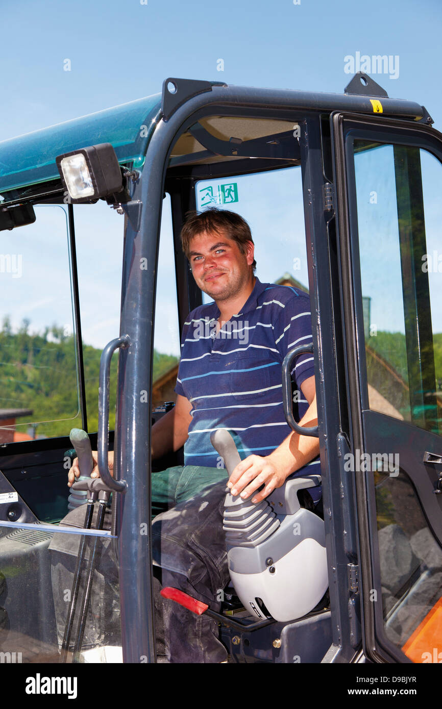 Man driving digger hi-res stock photography and images - Alamy