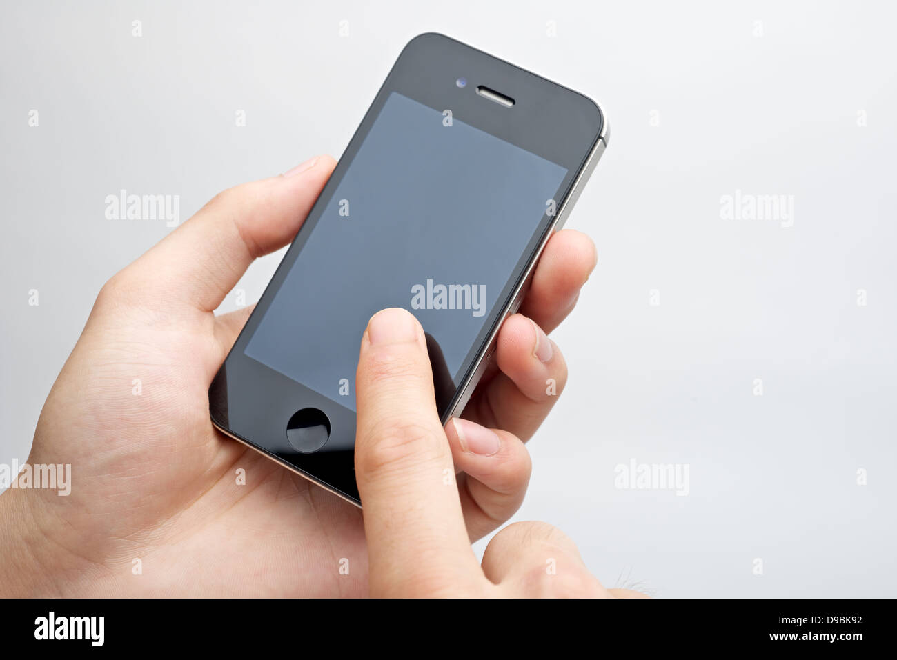 Finger touching iphone on white background Stock Photo - Alamy