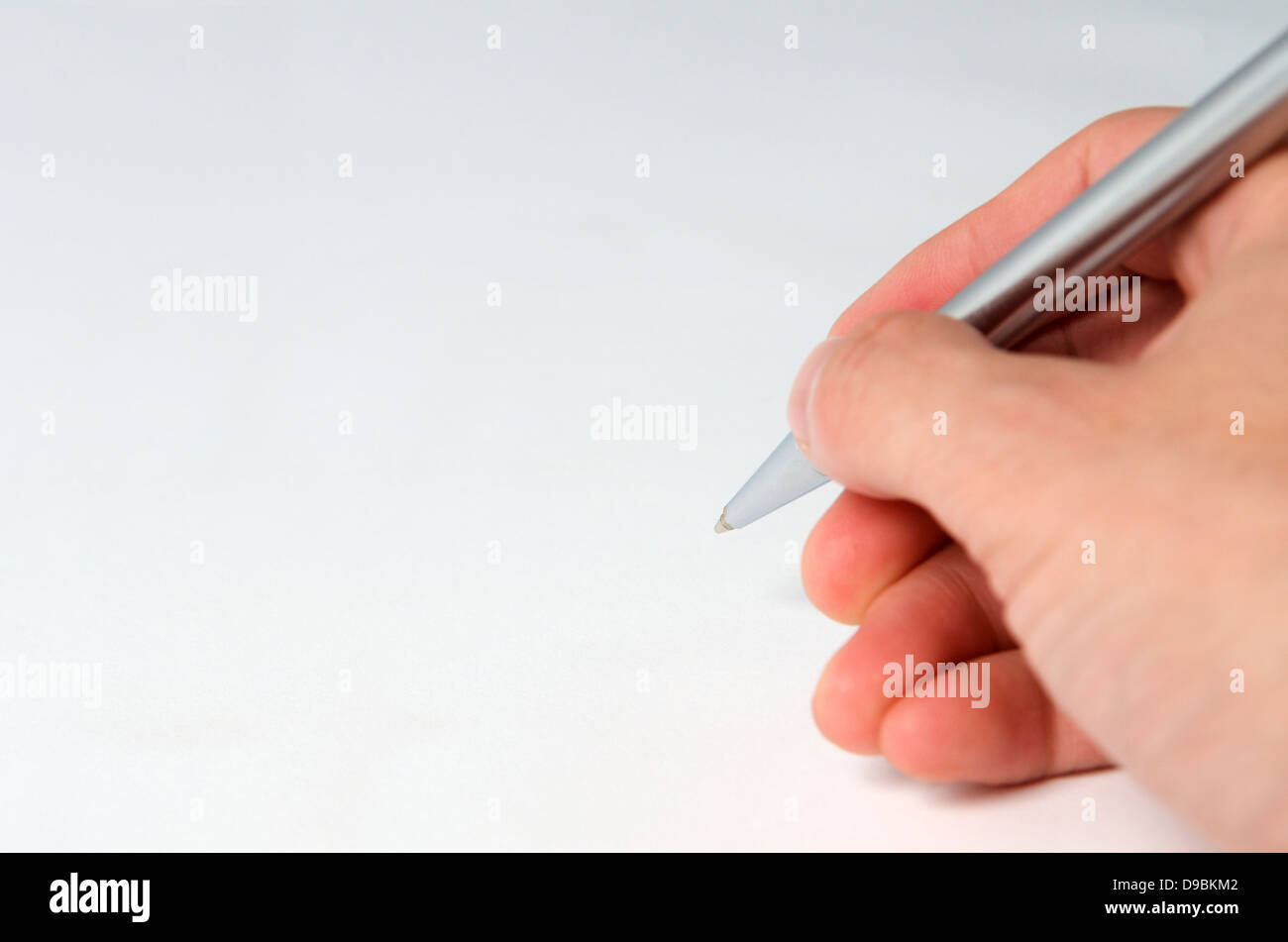 Hand with pen writing on blank paper Stock Photo - Alamy