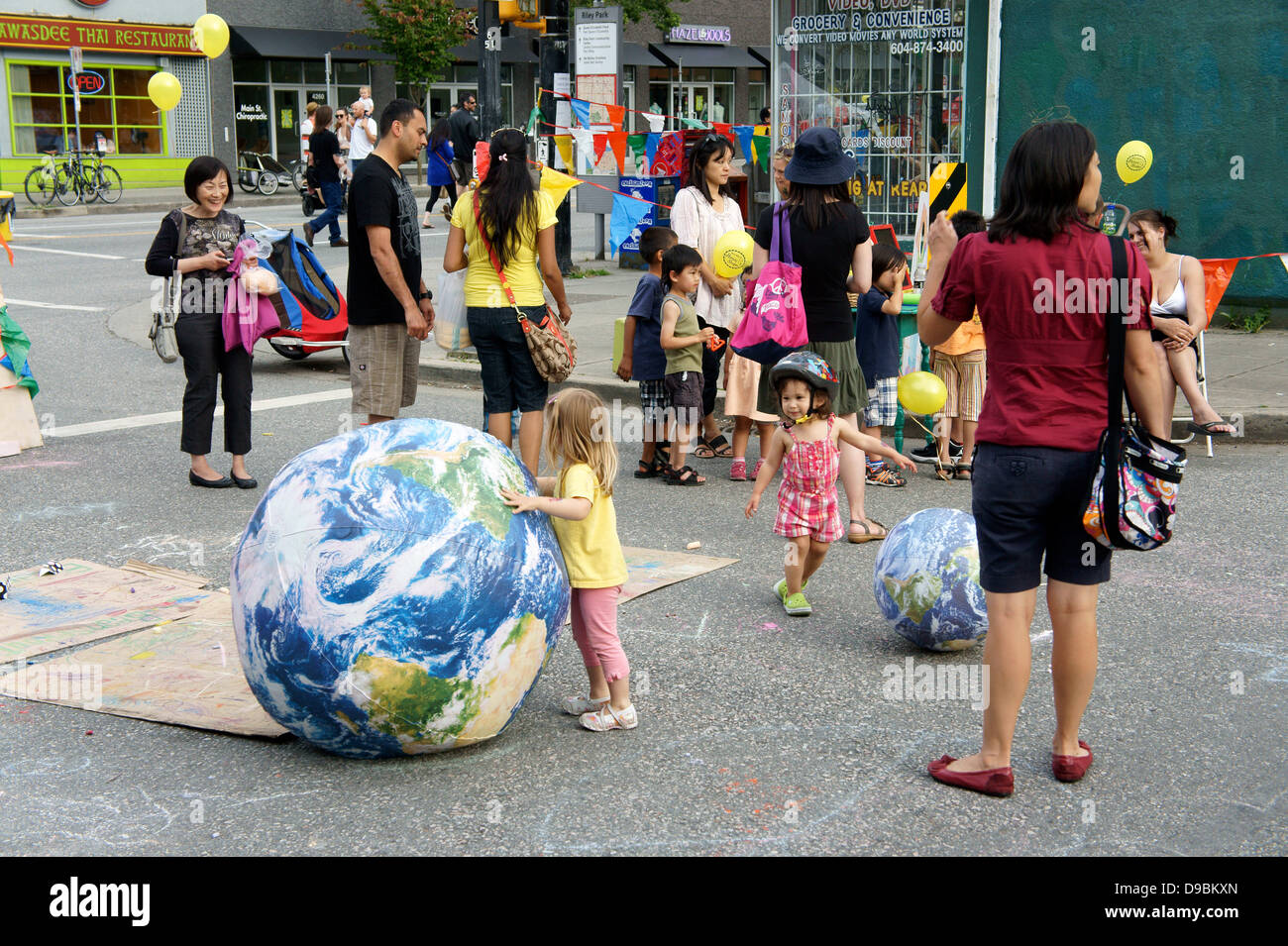Children playing with Earth balls at the Car Free Day festival on Main ...