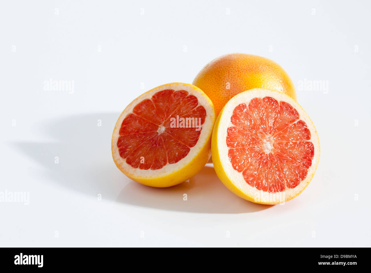 Grapefruits on white background, close up Stock Photo - Alamy
