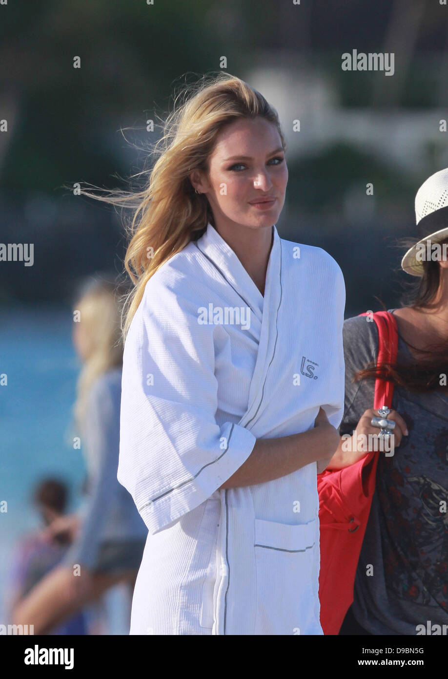 Candice Swanepoel frolicks in the surf while modeling beach wear for a ...