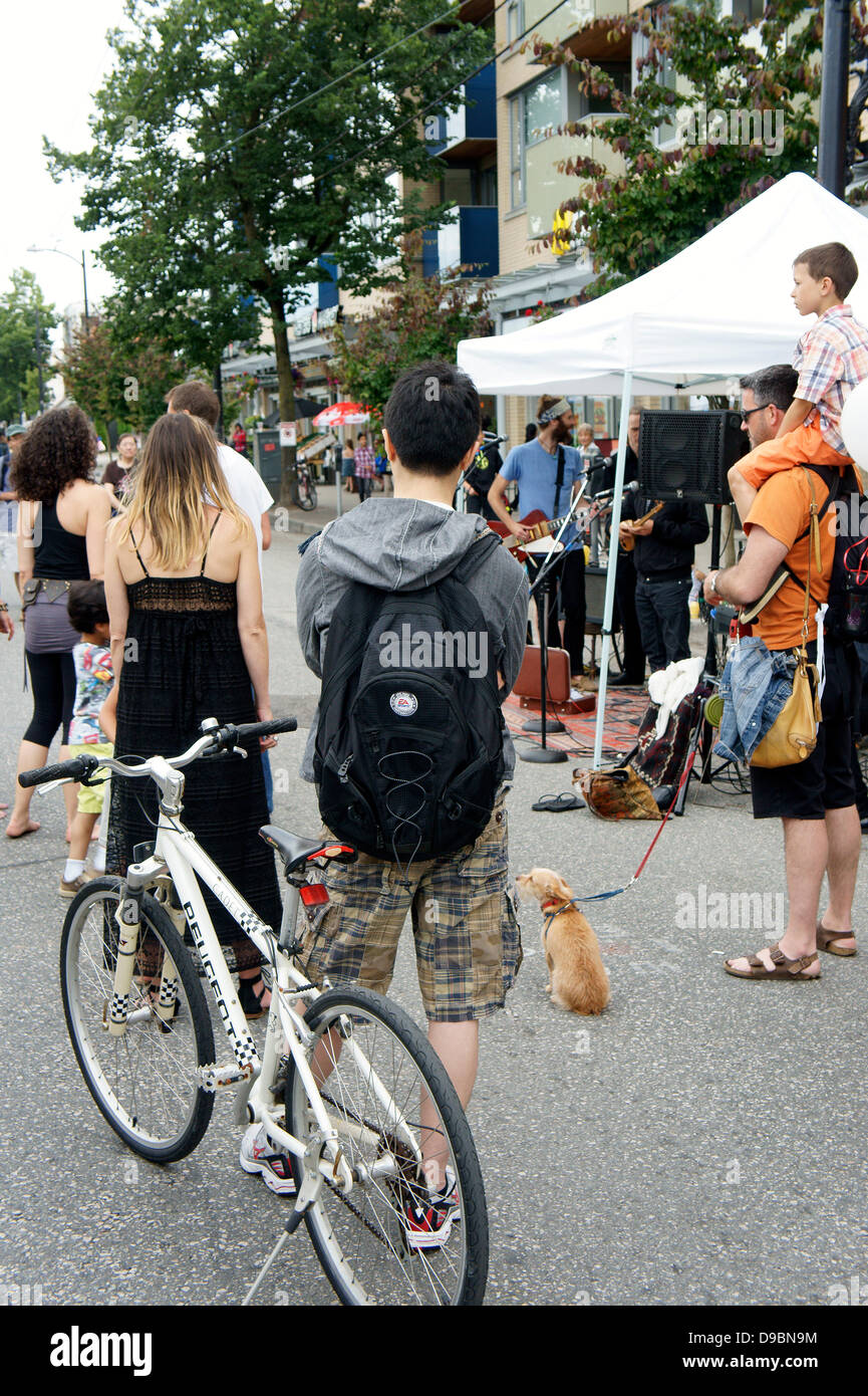 People watching a band perform at at the Car Free Day festival on Main ...