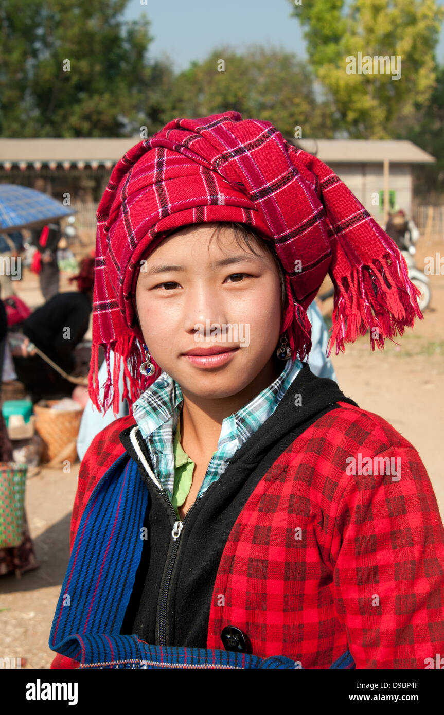 Pretty Pa-O girl wearing a red checked headdress looking at the camera ...