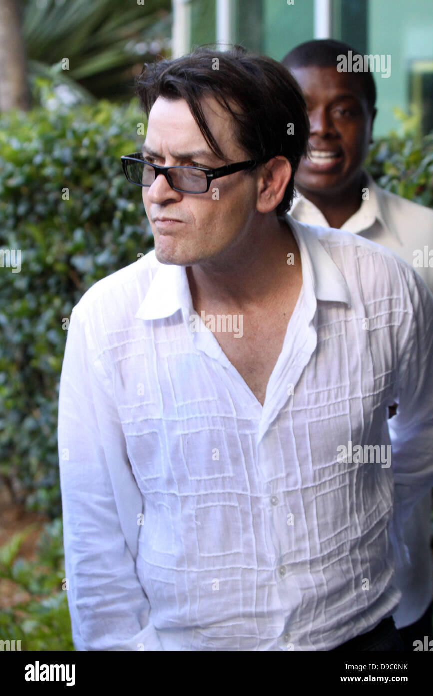 Charlie Sheen makes his way to an interview at NAPTE 2012 in Miami ...