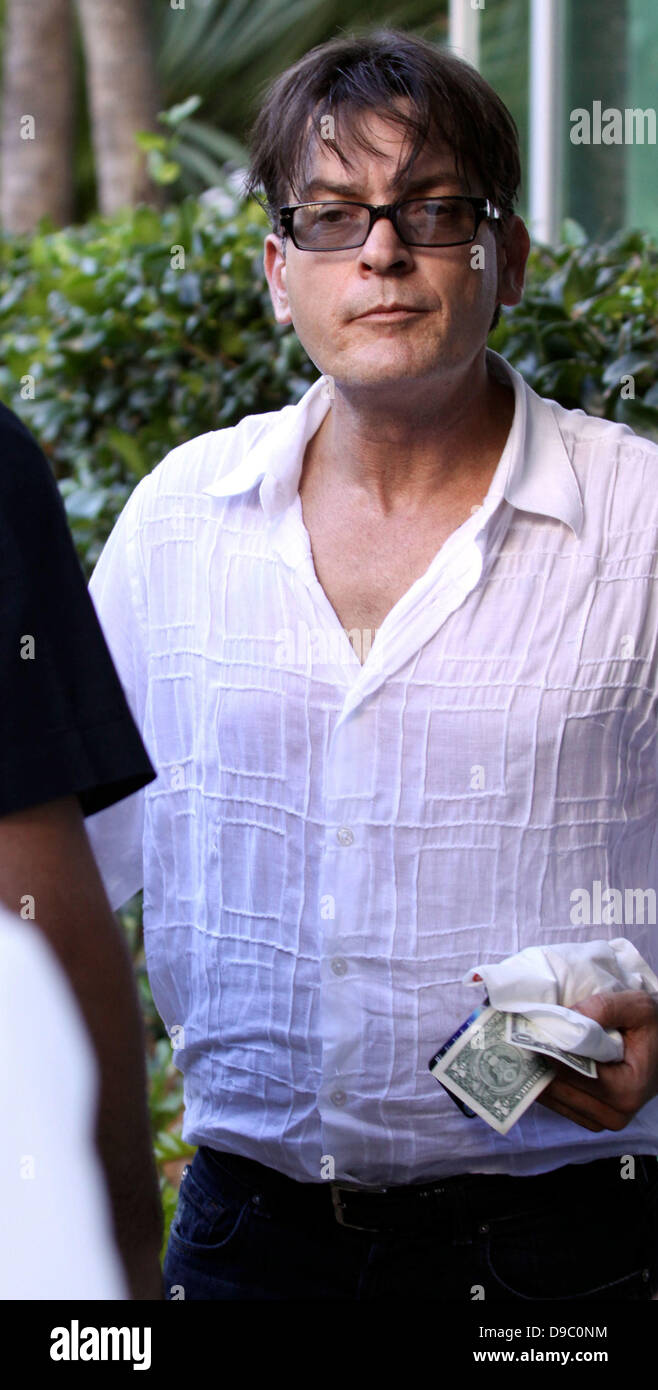 Charlie Sheen makes his way to an interview at NAPTE 2012 in Miami ...