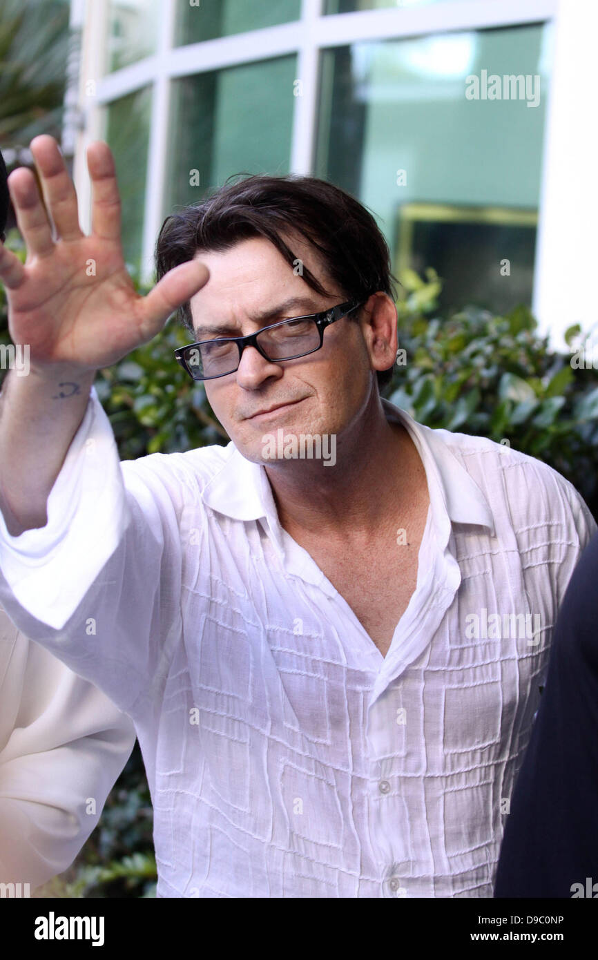 Charlie Sheen makes his way to an interview at NAPTE 2012 in Miami ...