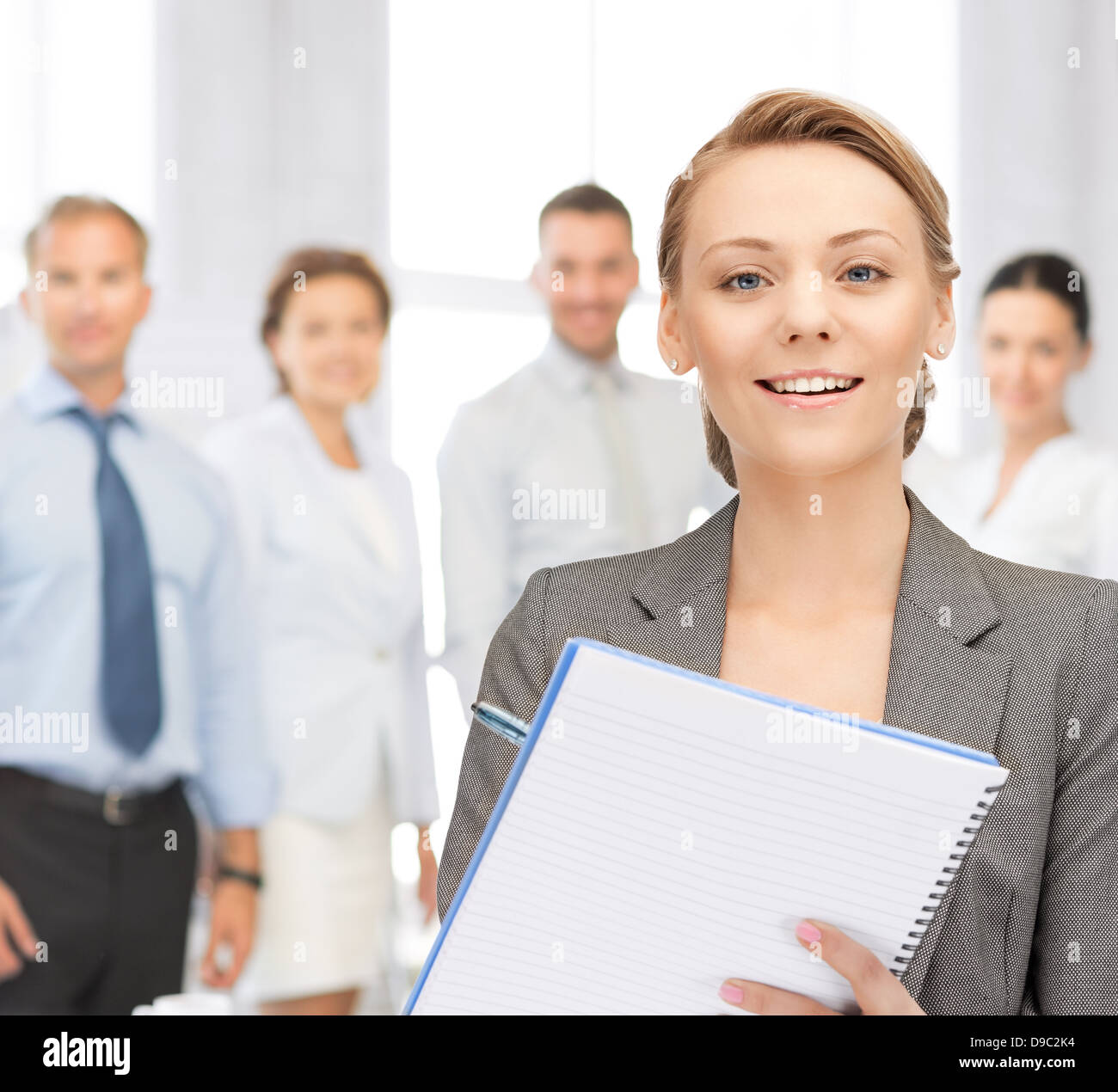 happy woman with big notepad Stock Photo - Alamy