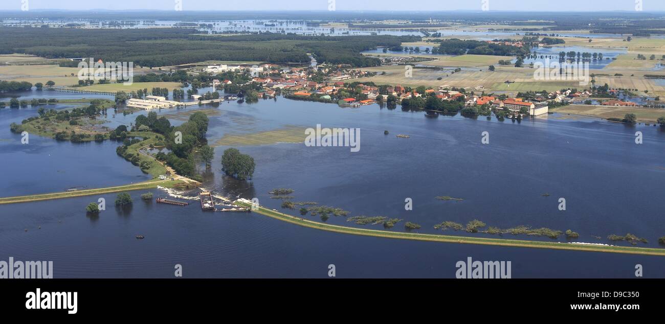Deliberately placed river barges block the gap of a breached dam in ...