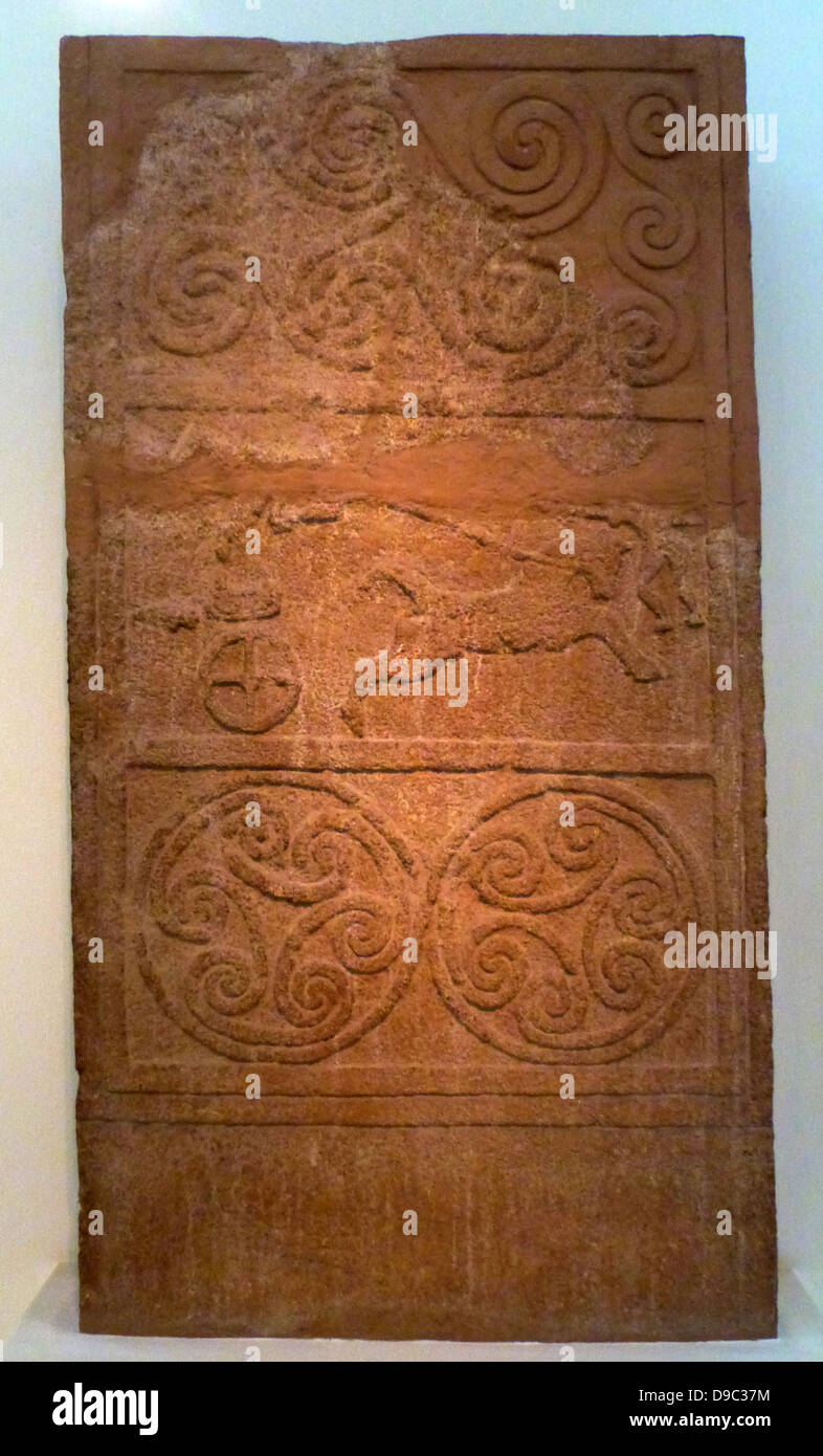 Funerary Stele made from porous stone with a chariot scene in relief ...