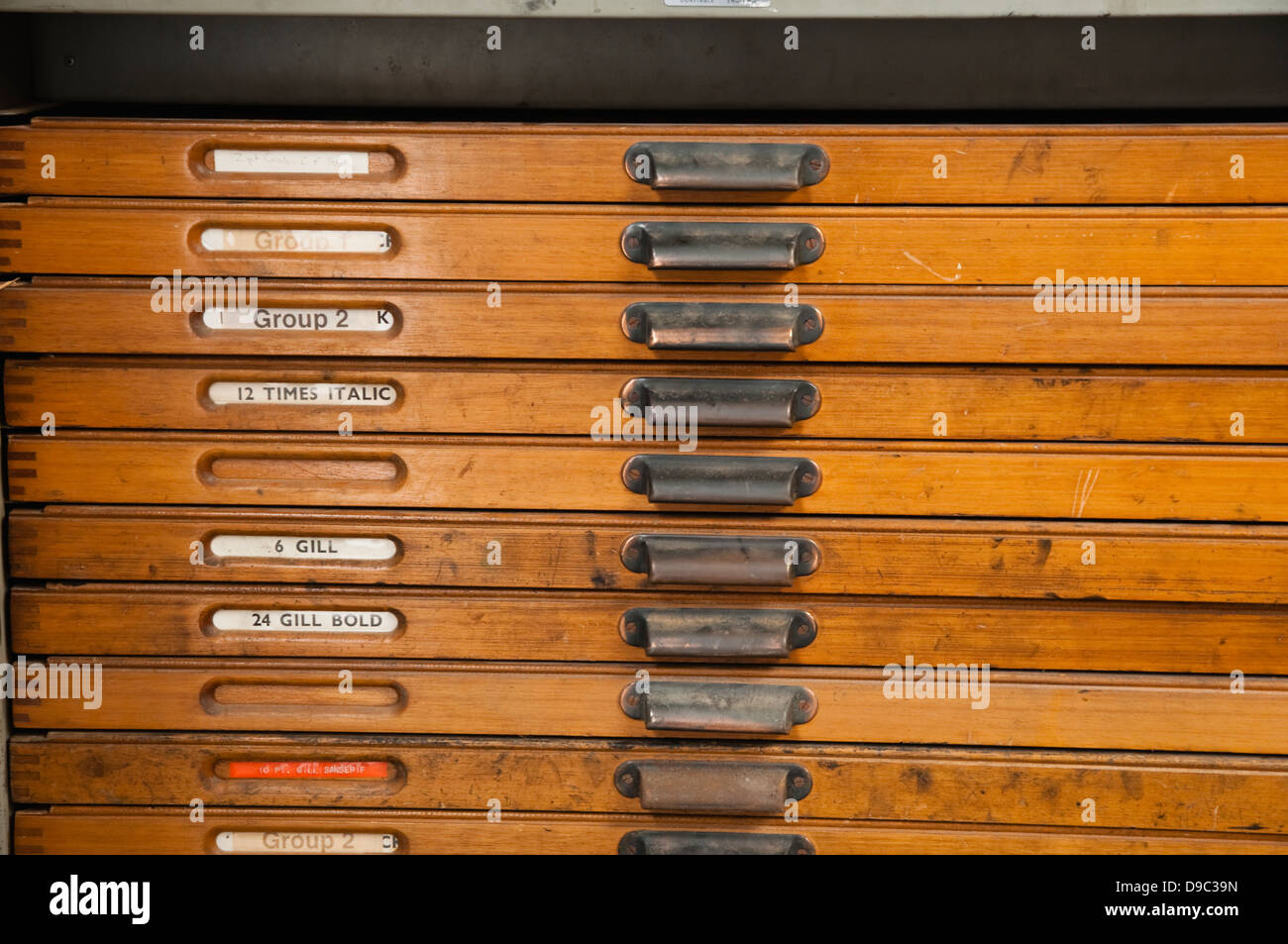 Drawers for storing printing letters labeled with the names of various ...