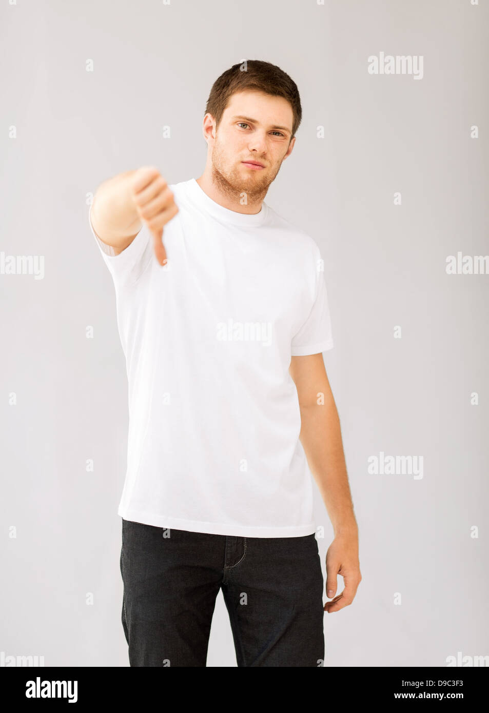 man showing thumbs down Stock Photo - Alamy