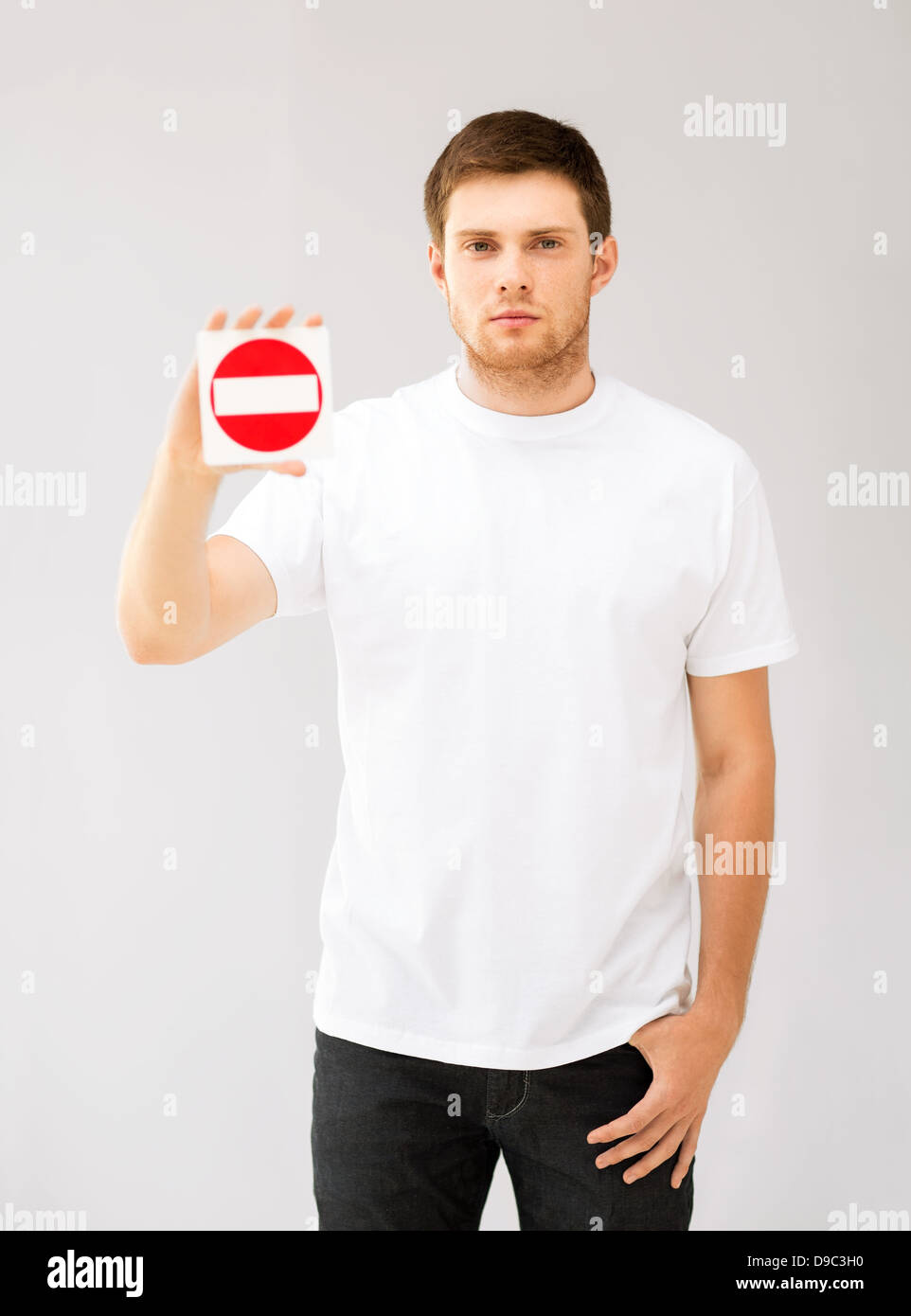 young man showing no entry sign Stock Photo - Alamy
