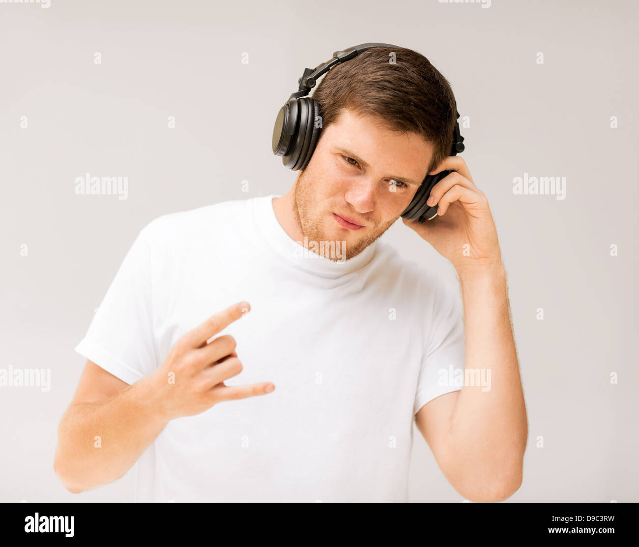 man with headphones listening rock music Stock Photo - Alamy