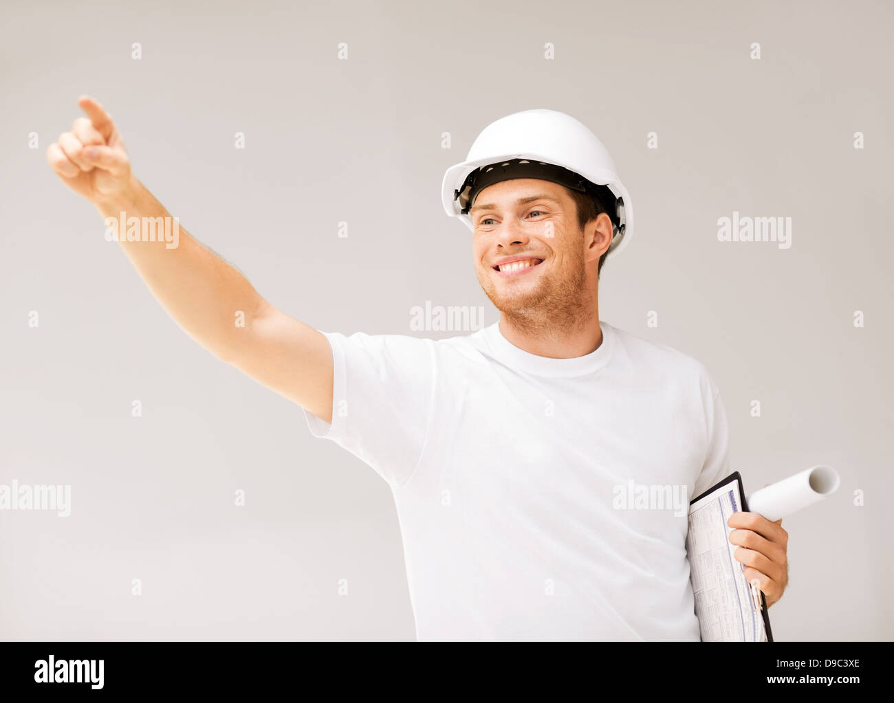 male architect looking at blueprint Stock Photo - Alamy