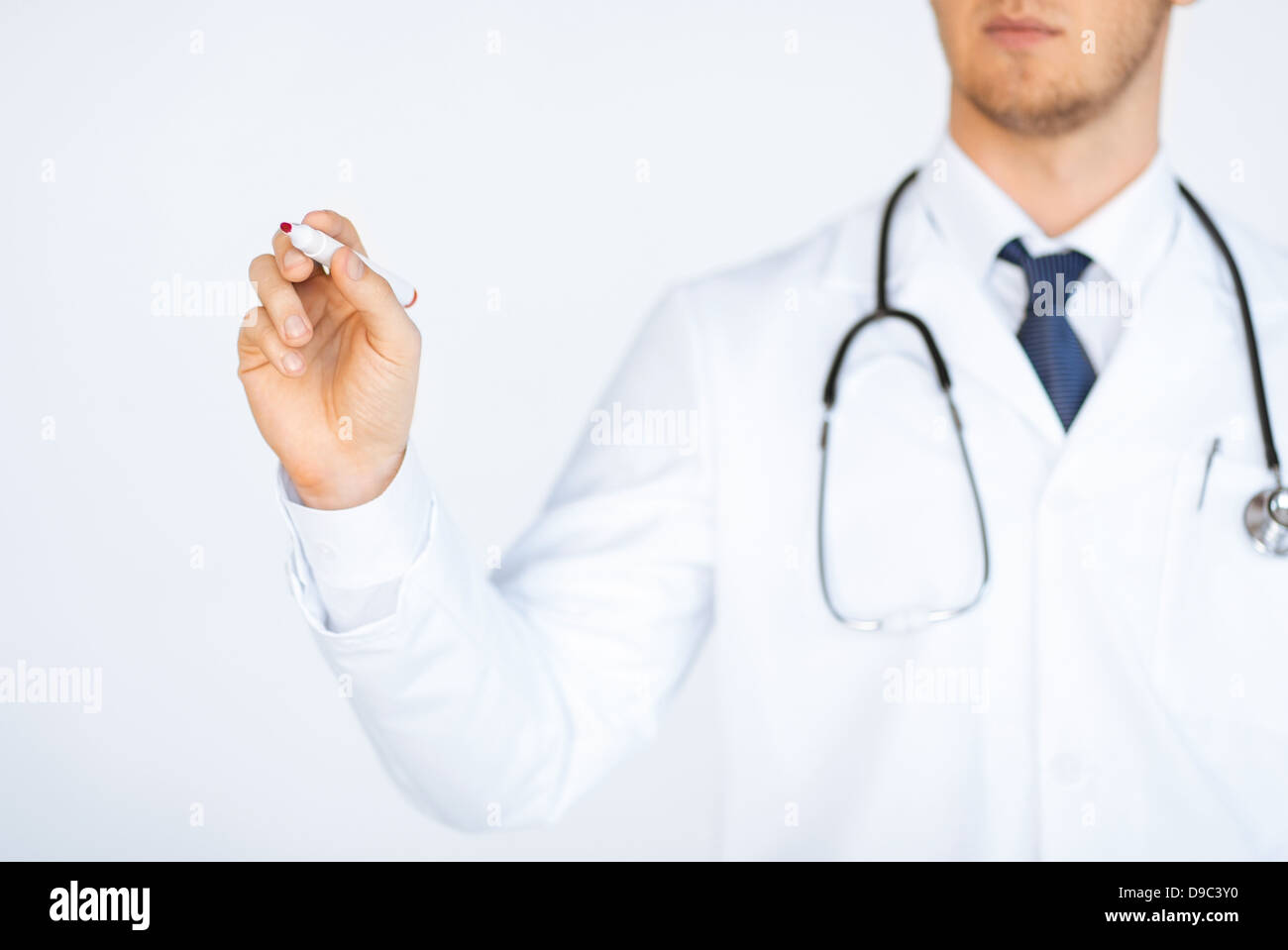doctor writing something in the air Stock Photo - Alamy
