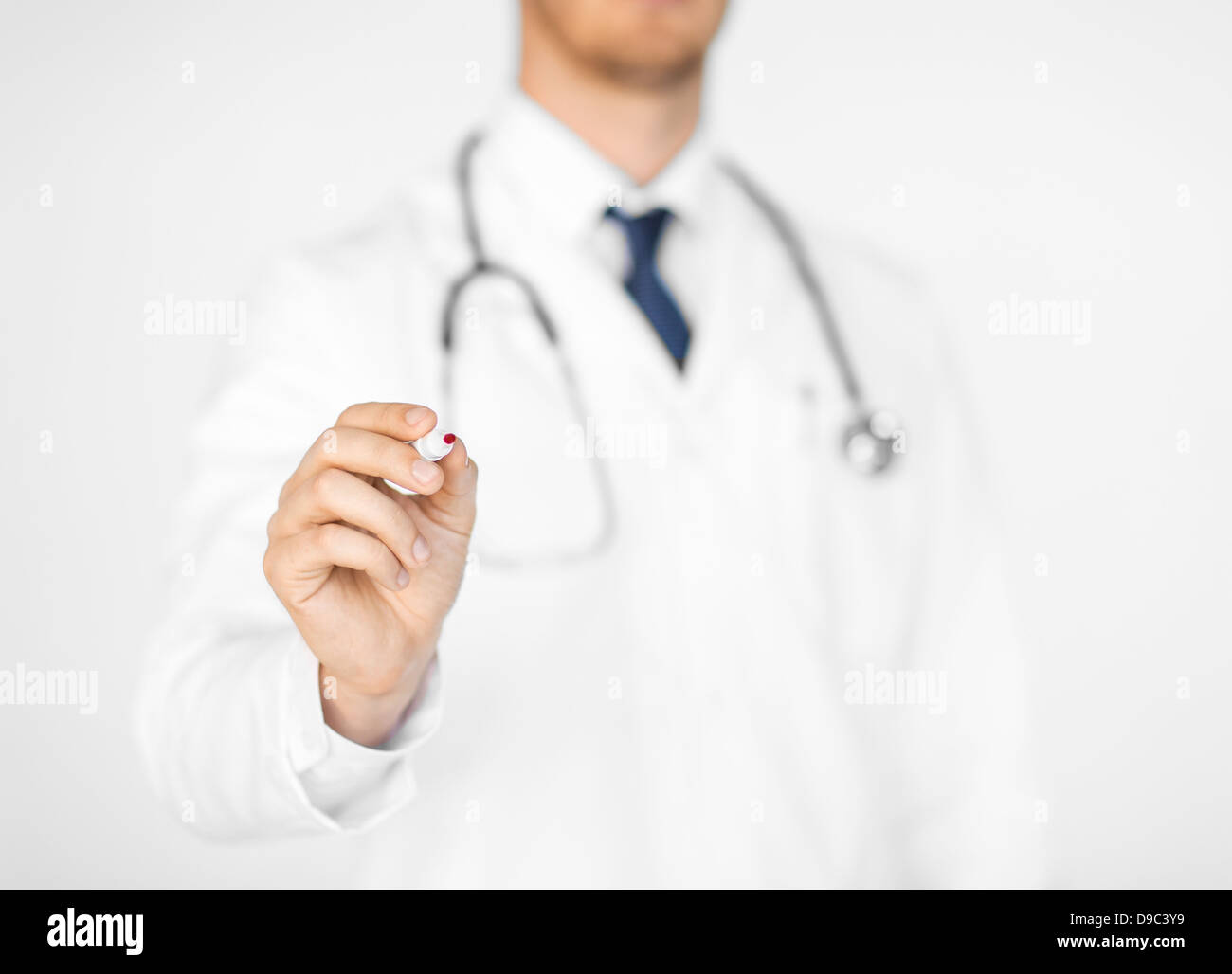 doctor writing something in the air Stock Photo - Alamy