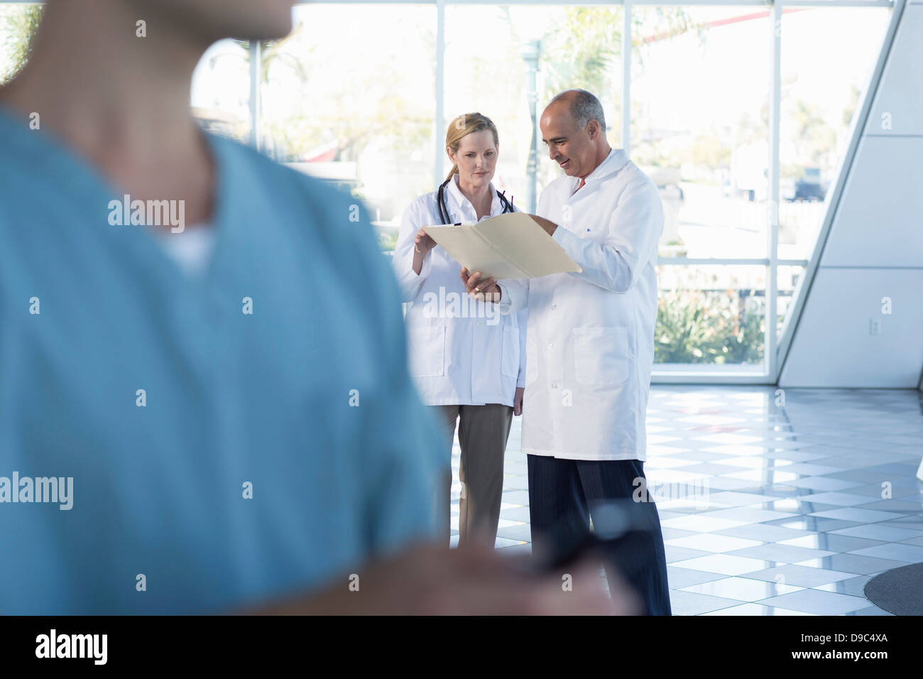 Two doctors discussing medical records Stock Photo - Alamy