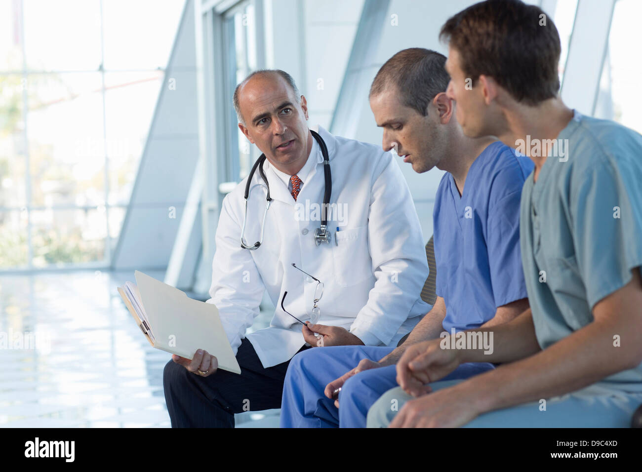 Three male doctors Stock Photo - Alamy