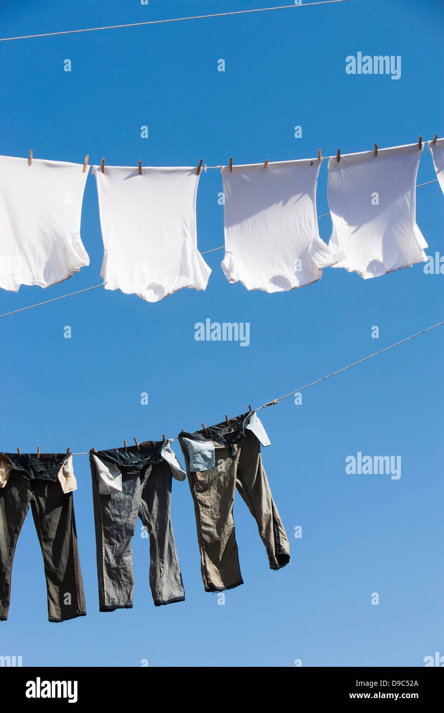 T shirts and trousers on clothes line Stock Photo - Alamy