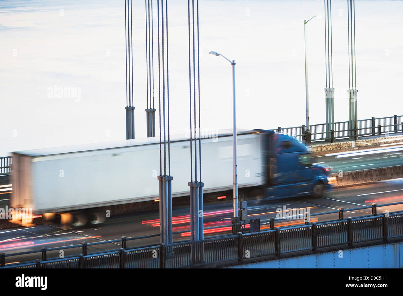 Container truck crossing bridge Stock Photo - Alamy