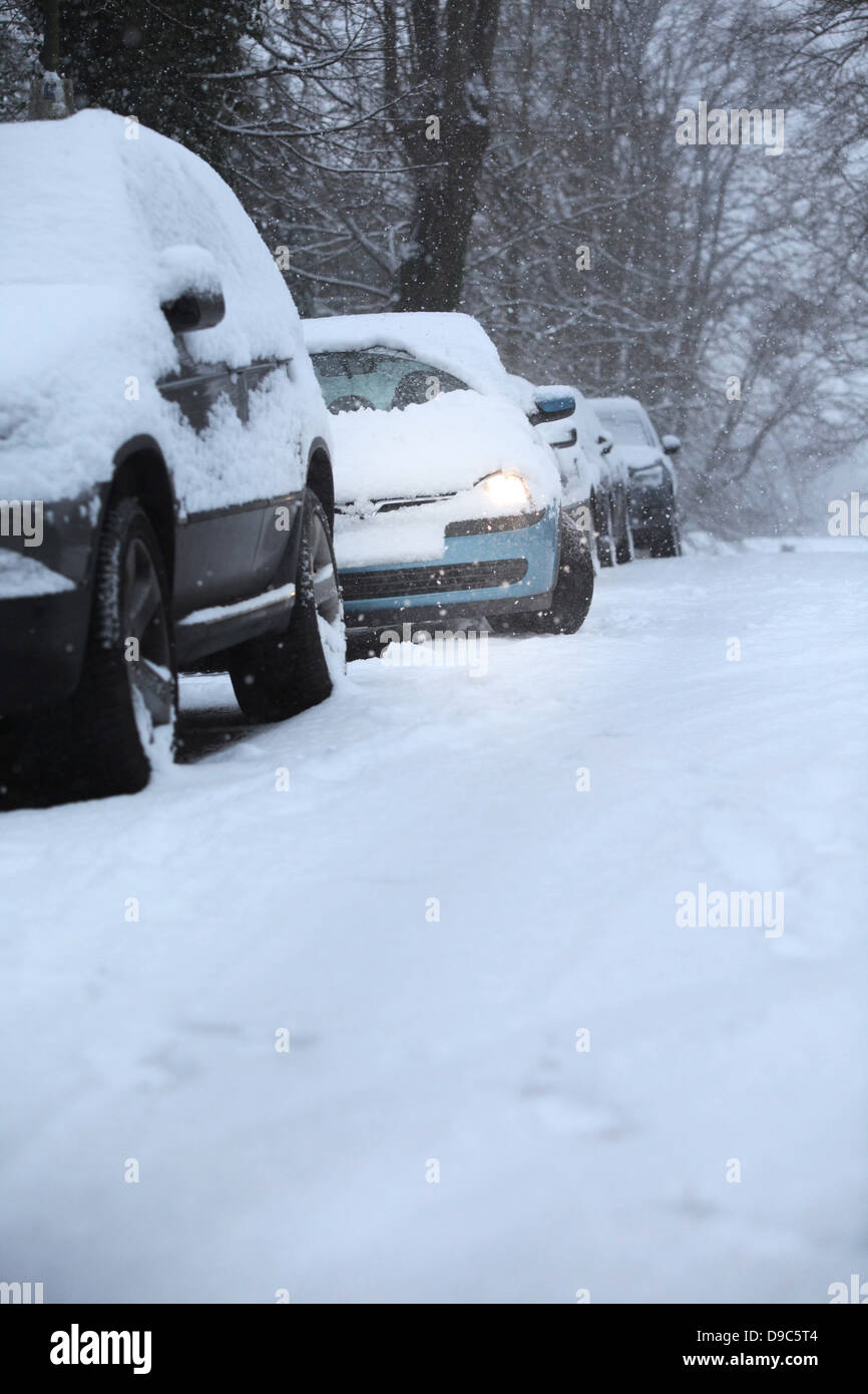 Car stuck in snow covered street Stock Photo - Alamy