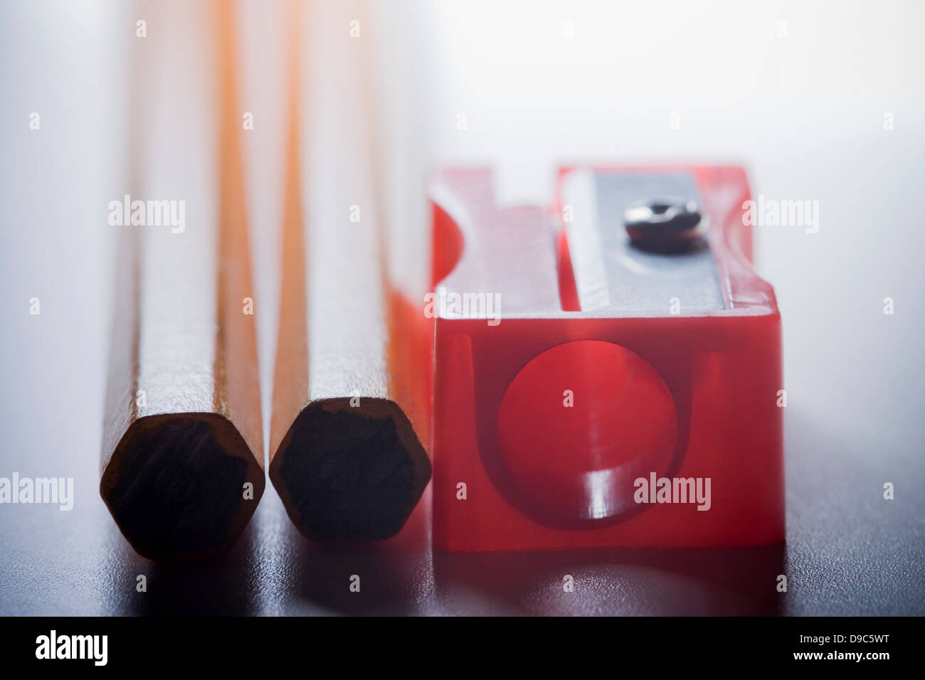 Two pencils and pencil sharpener Stock Photo - Alamy