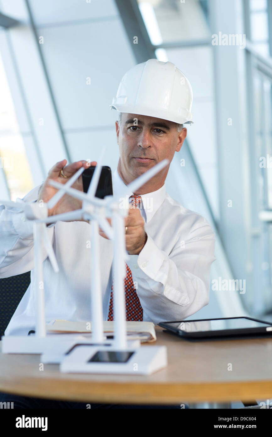Engineer photographing model wind turbines Stock Photo - Alamy