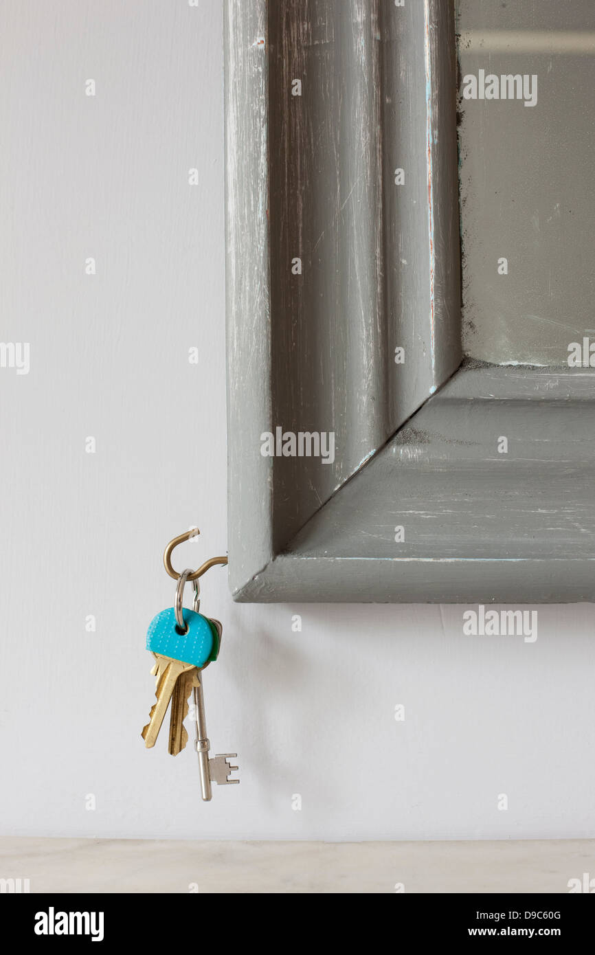House keys on hook on mirror Stock Photo - Alamy