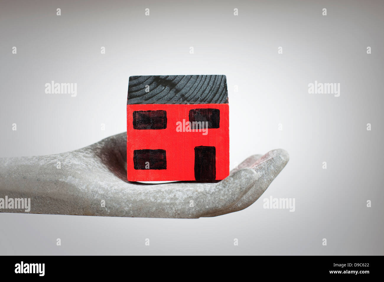 Hand holding model of house Stock Photo - Alamy