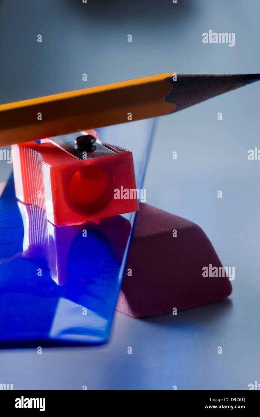Eraser, ruler, pencil sharpener and pencil in a pile Stock Photo - Alamy