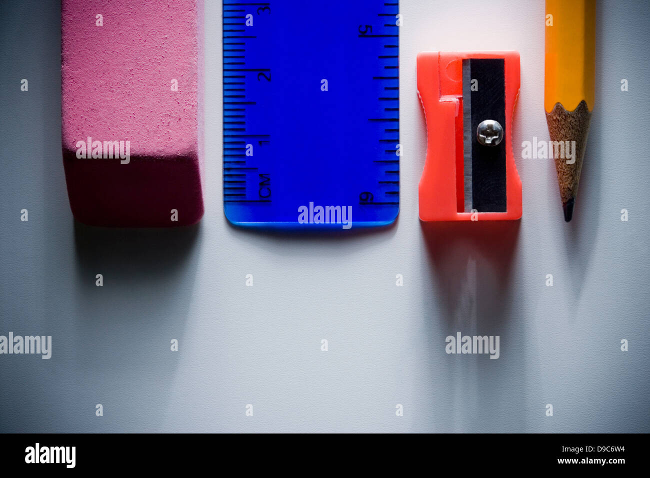 Eraser, ruler, pencil sharpener and pencil Stock Photo - Alamy