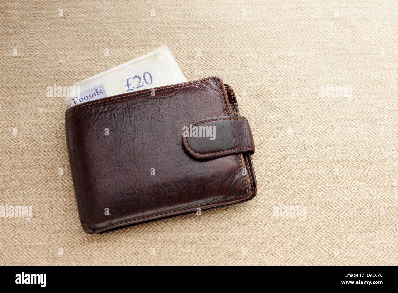 Brown leather wallet with twenty pound note Stock Photo - Alamy