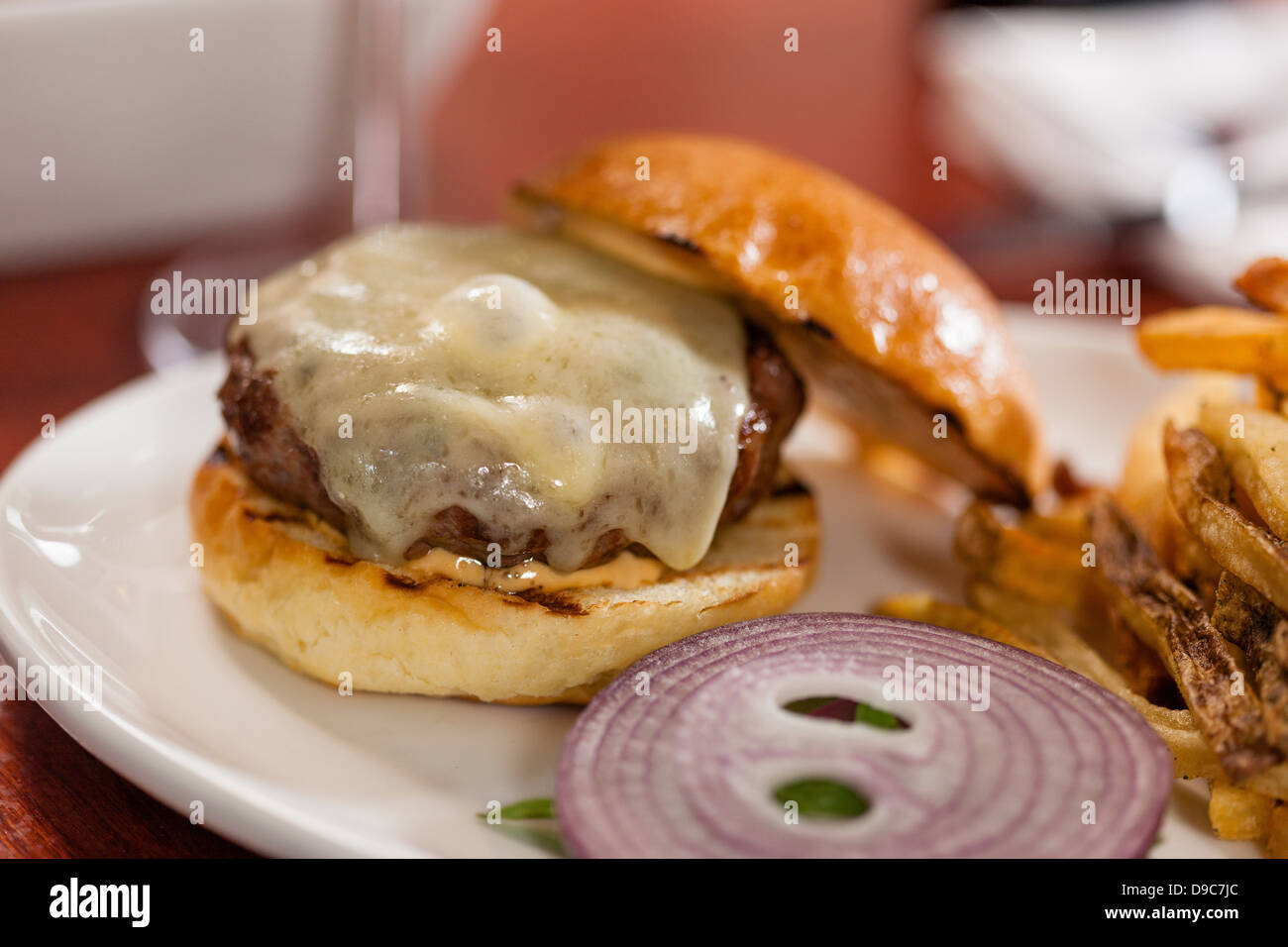Cheese melted on burger Stock Photo - Alamy
