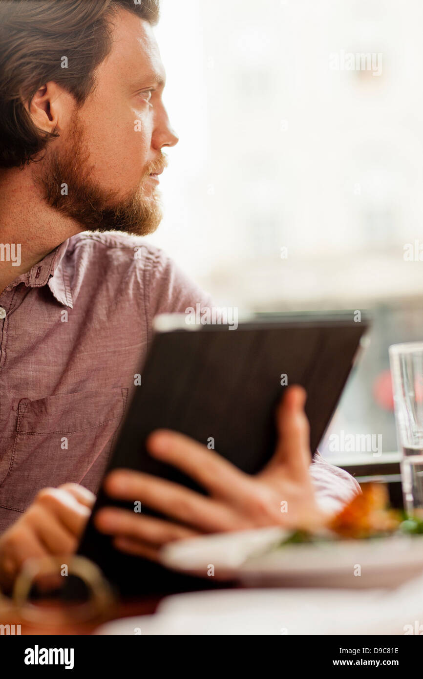 Man using digital tablet Stock Photo - Alamy