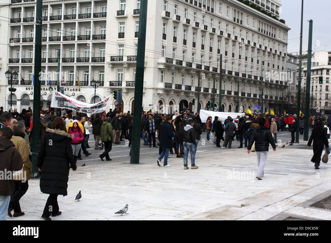 Protesters march in Syntagma square against austerity cuts to budgets ...
