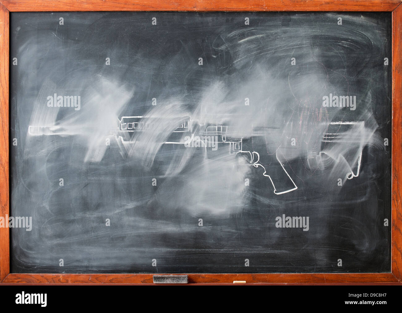 Partially erased chalk drawing of gun on blackboard Stock Photo - Alamy