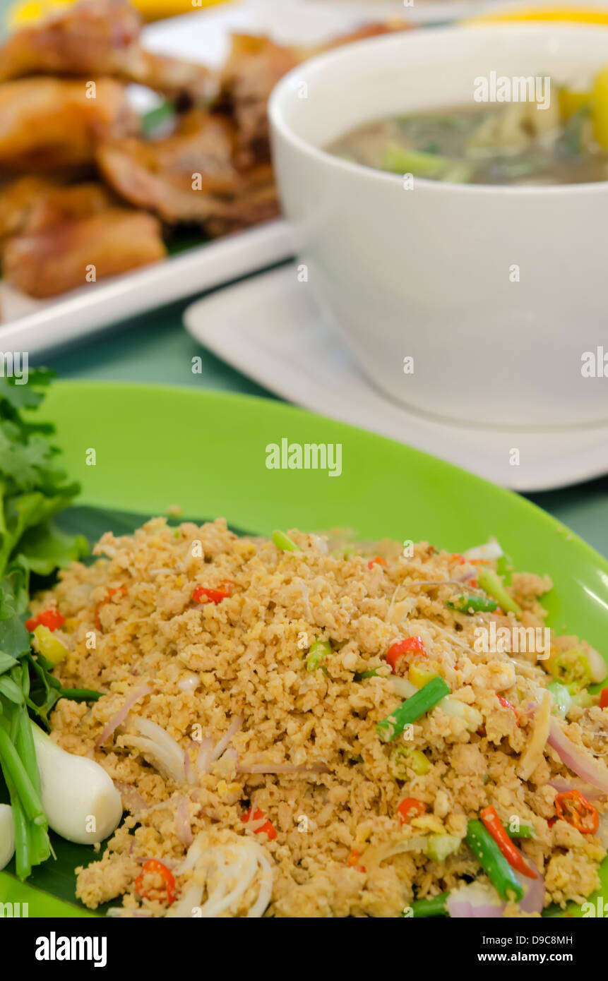 close up fried fish roe with mix vegetable, served with fresh green ...
